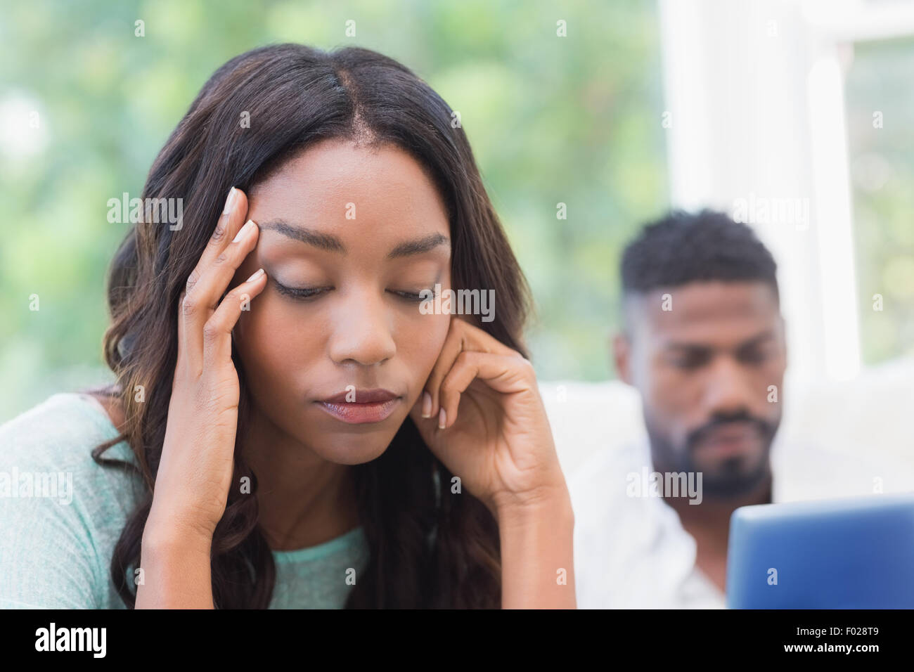 Upset woman being ignored by partner Stock Photo - Alamy