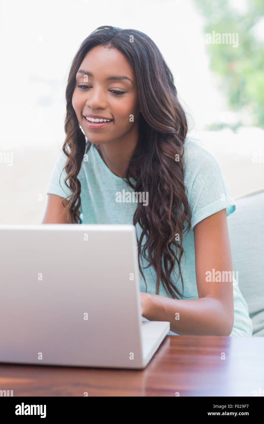 Happy woman using her laptop Stock Photo - Alamy