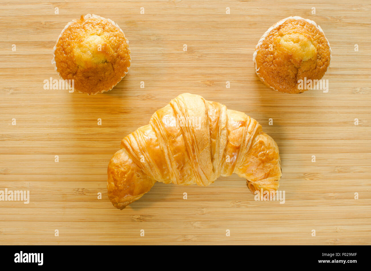 Bread face shaped on wood board Stock Photo - Alamy