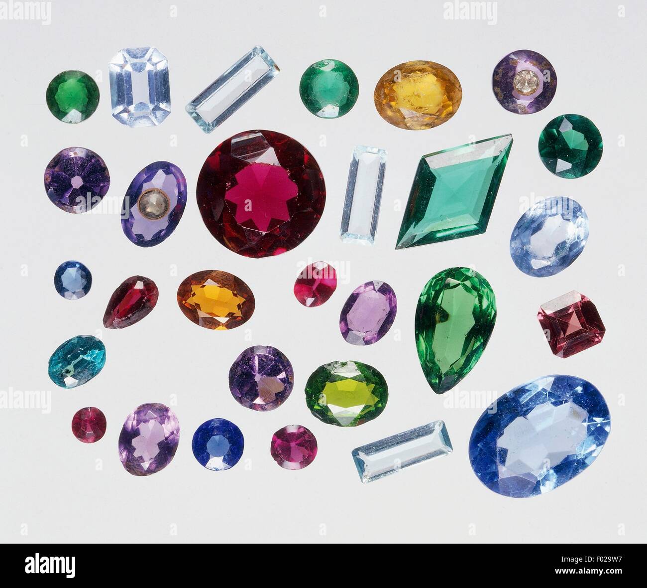 Colored gemstones with different shapes and cuts Stock Photo - Alamy