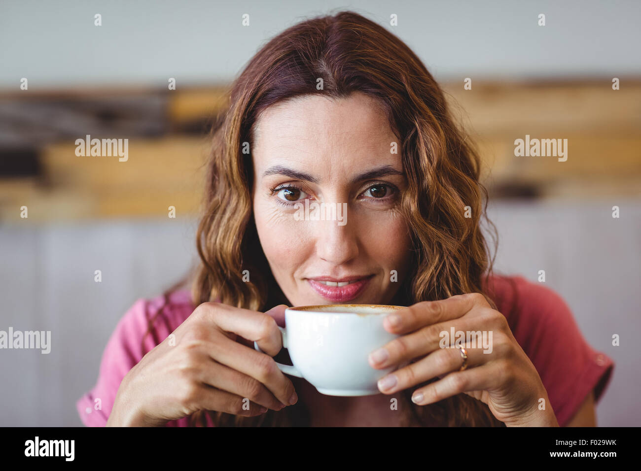 Young woman having a coffee Stock Photo - Alamy