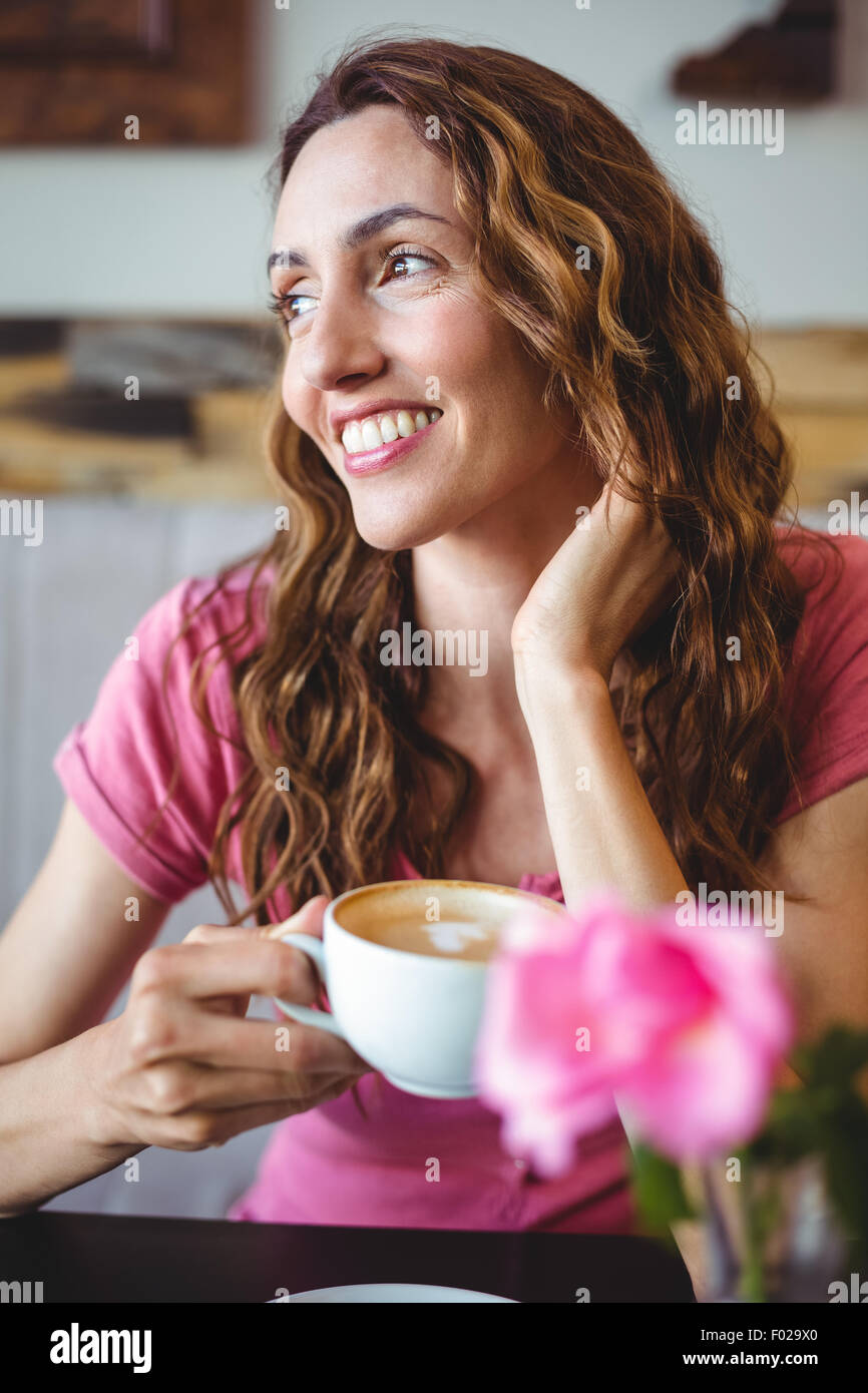 Young woman having a coffee Stock Photo - Alamy