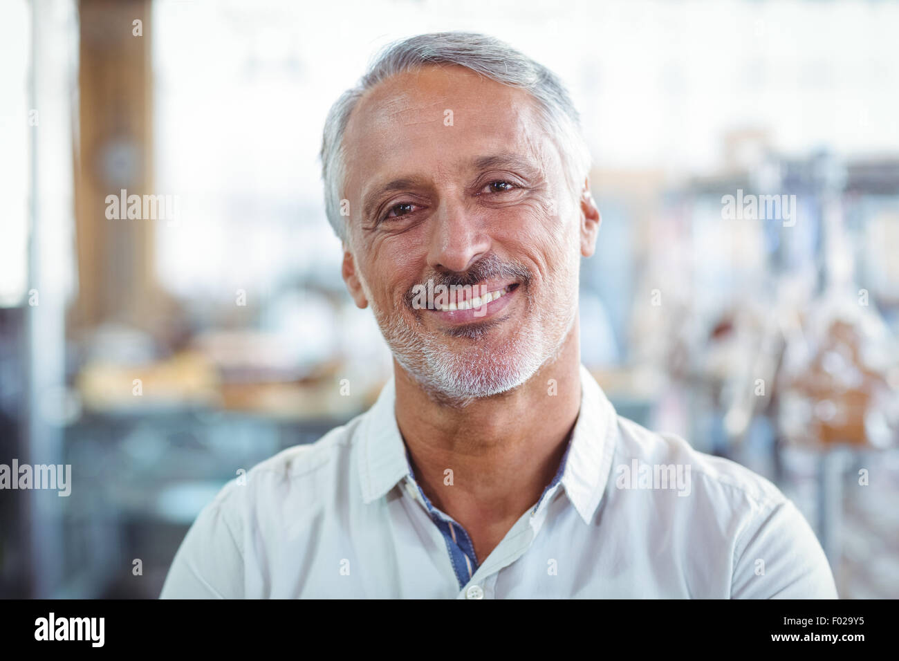 smiling customer looking at the camera Stock Photo - Alamy