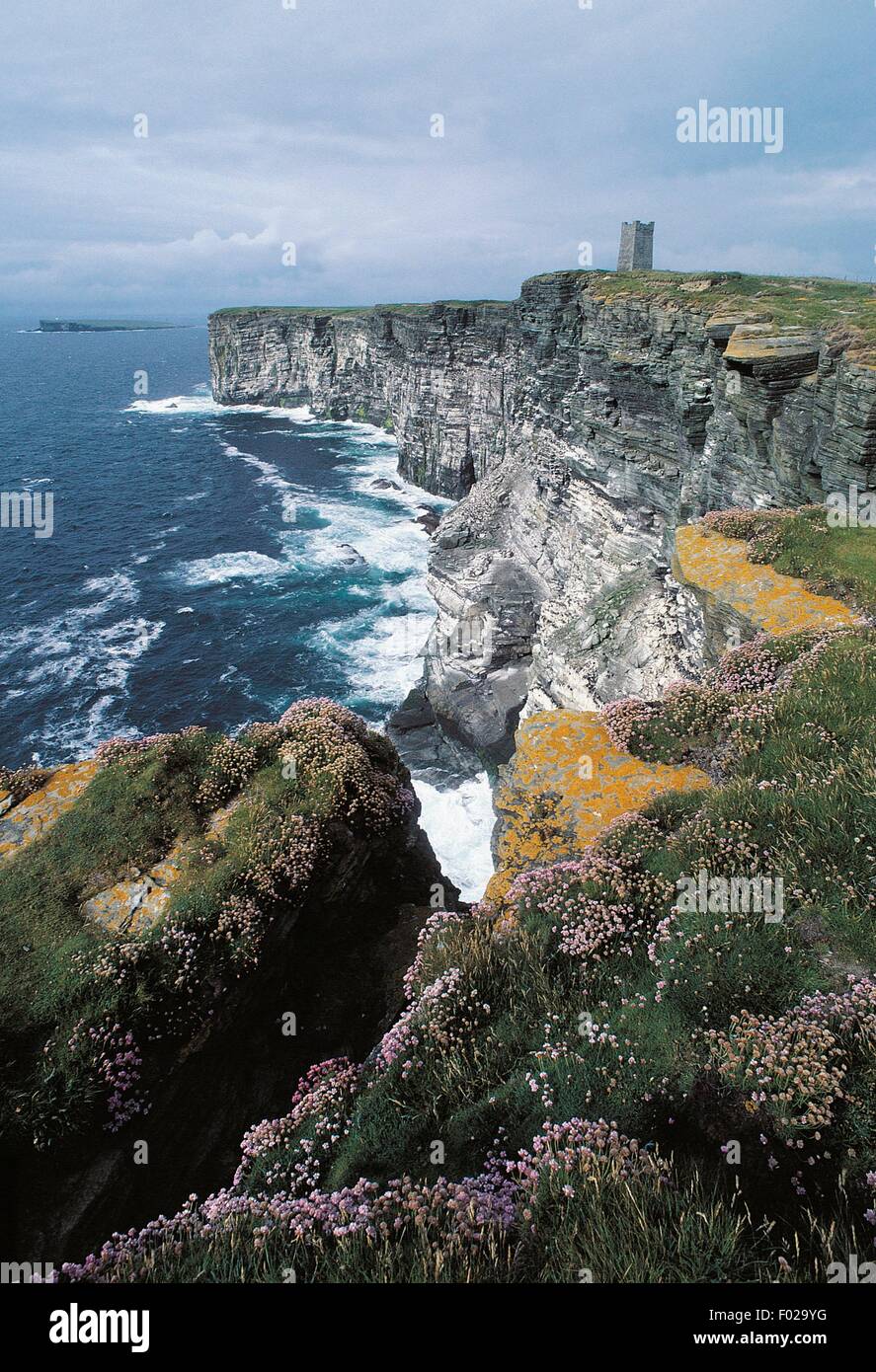The cliffs of Marwick Head with the memorial tower to Lord Horatio ...