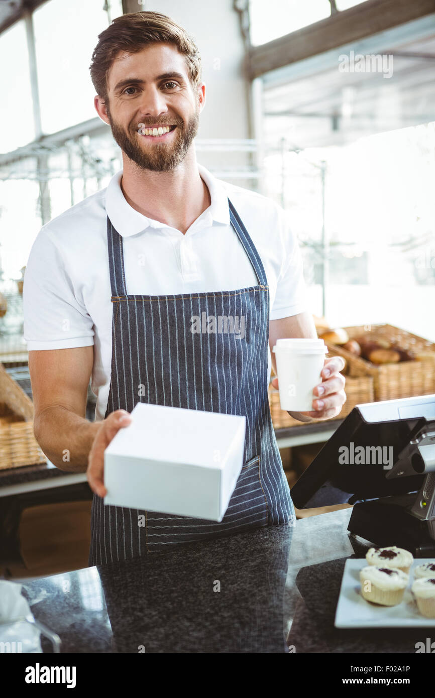 Smiling worker prepares orders Stock Photo - Alamy