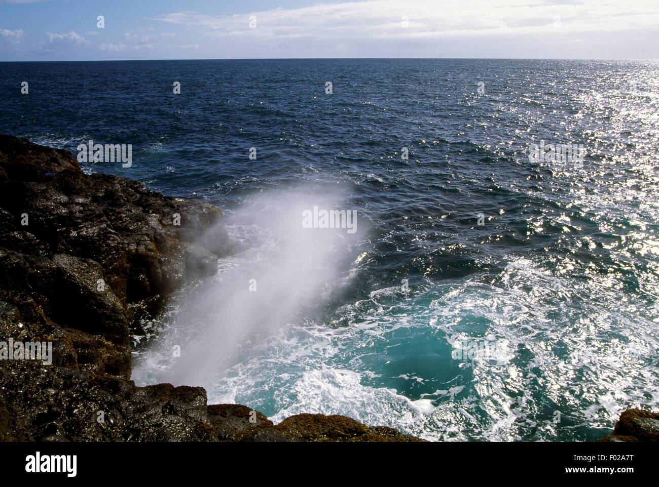 Wave breaking on a rock at Papenoo, Tahiti, French Polynesia Stock ...