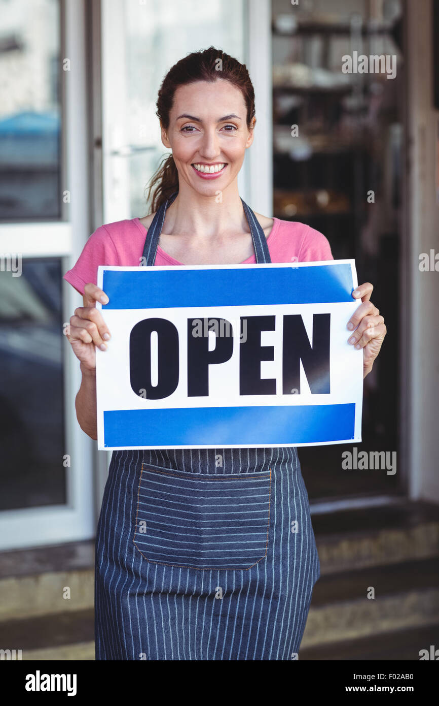 Cafe owner showing open sign hi-res stock photography and images - Alamy