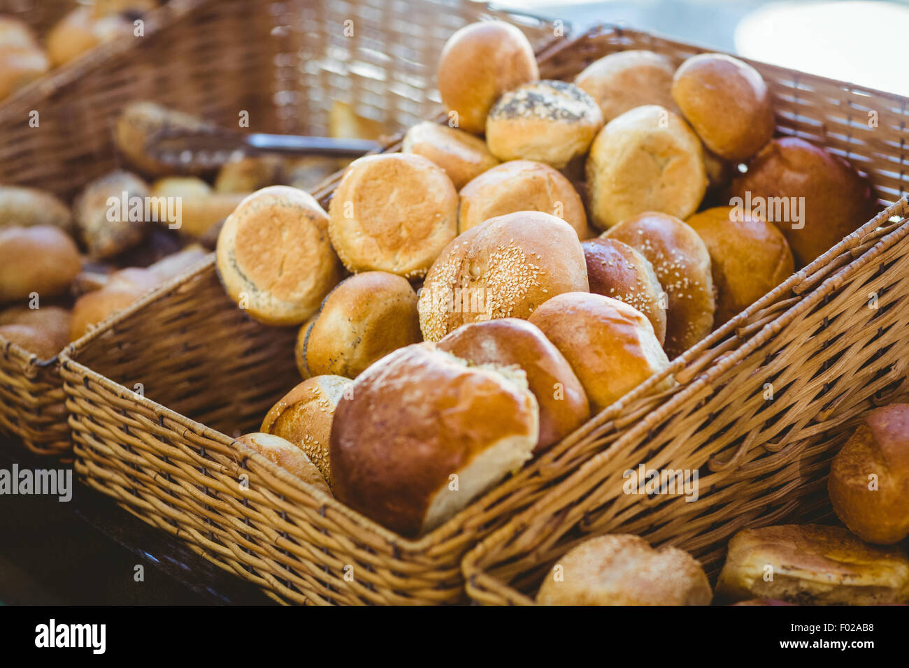 Basket filling with delicious bread Stock Photo - Alamy