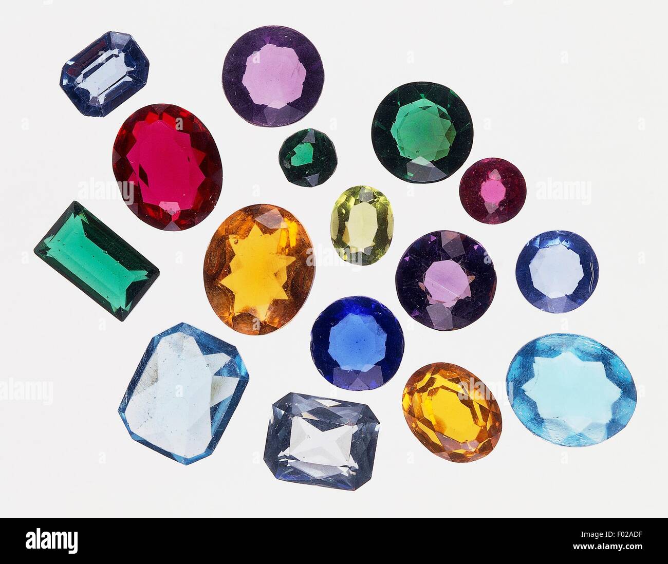 Colored gemstones with different shapes and cuts Stock Photo - Alamy