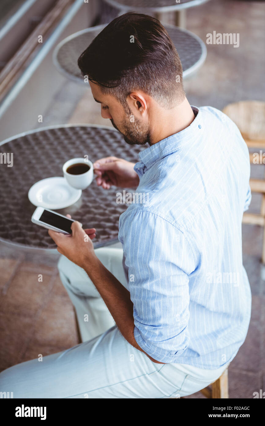 Focused business man texting message hi-res stock photography and ...