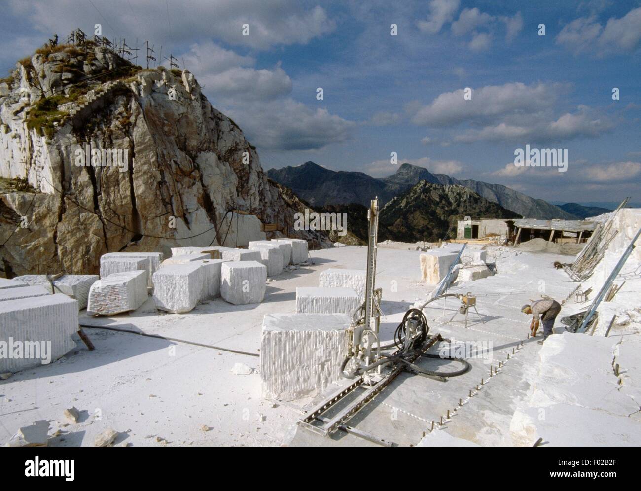Marble block squaring off in a quarry of Monte Altissimo, Apuan Alps ...