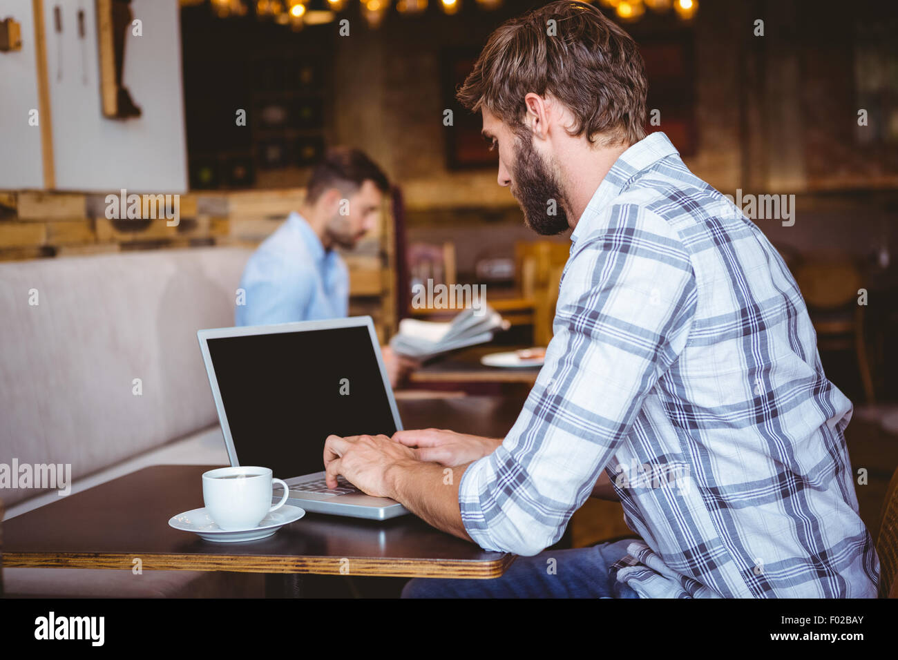 young man working on his computer Stock Photo - Alamy