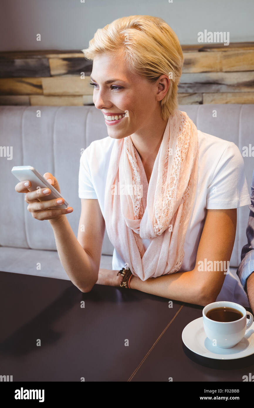 young woman texting with her friend Stock Photo - Alamy