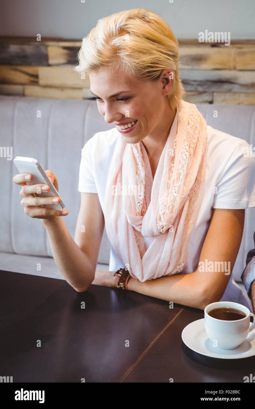 young woman texting with her friend Stock Photo - Alamy