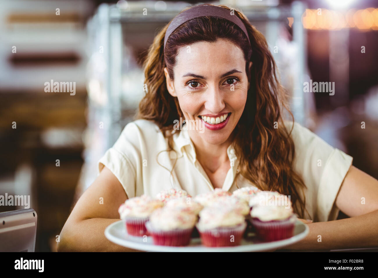 Pretty brunette smiling at camera Stock Photo - Alamy