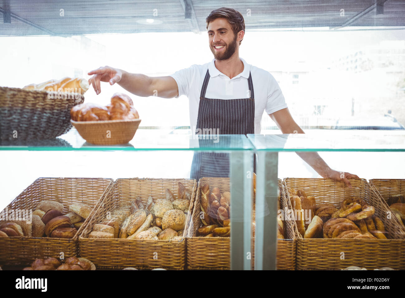Smiling male restaurant worker posing hi-res stock photography and ...