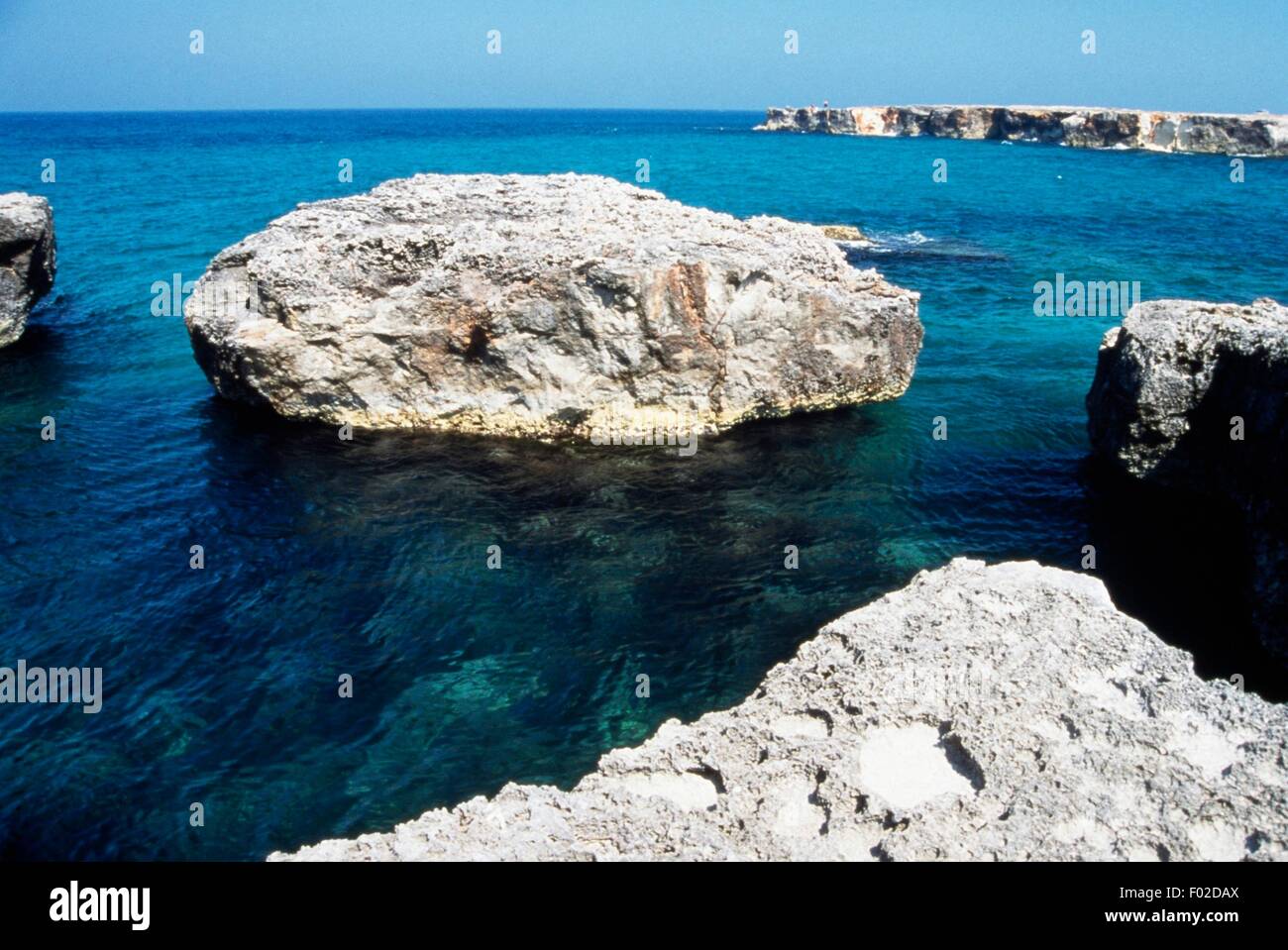 Rocks in the sea between Santa Foca and Roca Vecchia, Apulia, Italy ...