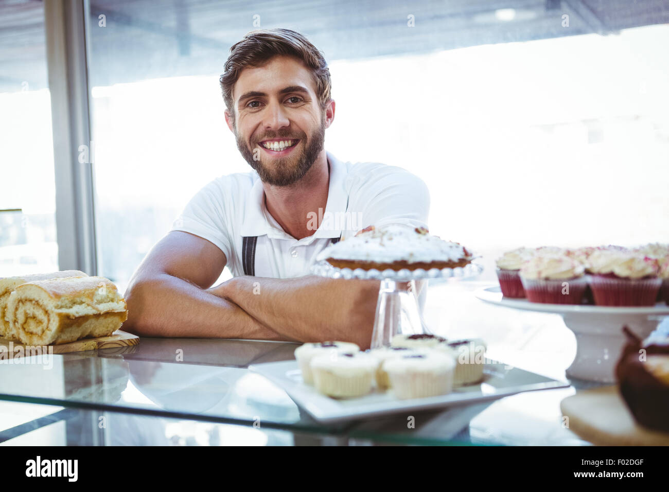Man at work behind the counter hi-res stock photography and images - Alamy