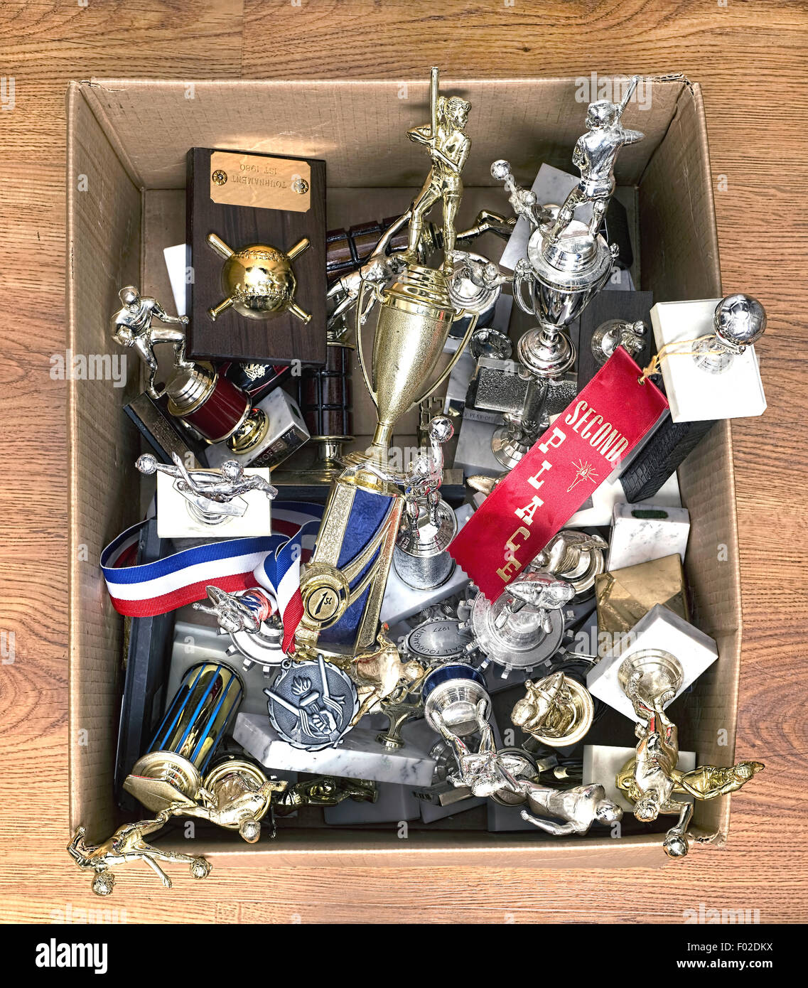 Kids box of winning sports trophies Stock Photo - Alamy