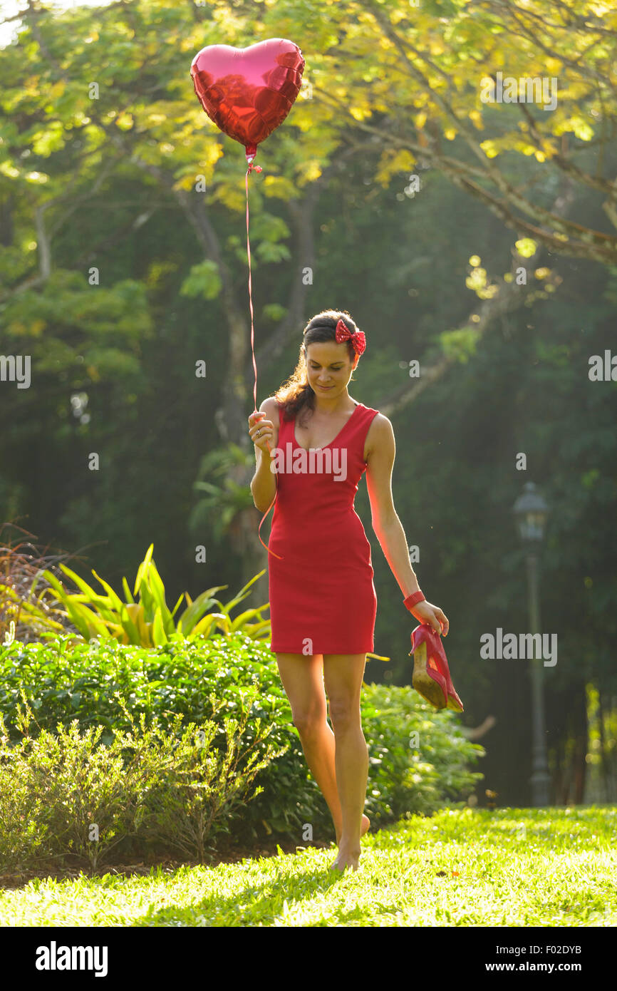 Woman carrying shoes hi-res stock photography and images - Alamy