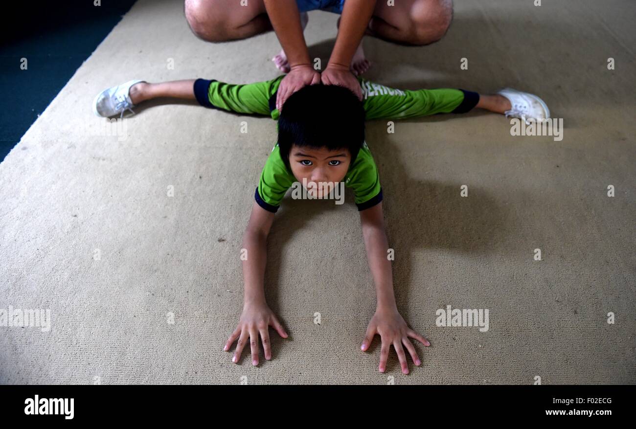 Linquan, China's Anhui Province. 6th Aug, 2015. A boy practises basic ...