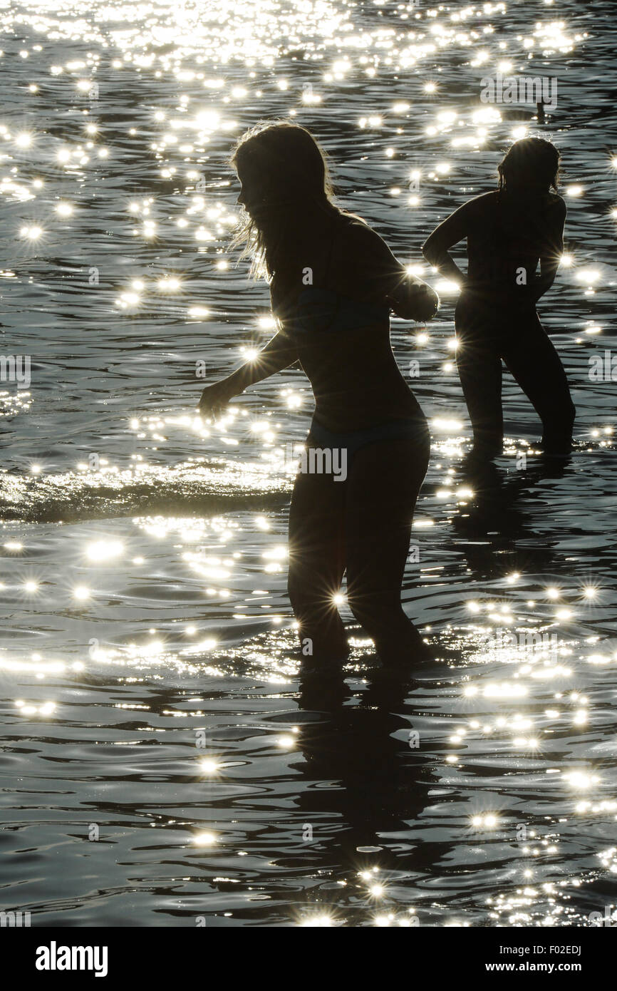Friedrichshafen, Germany. 5th Aug, 2015. Visitors swim in Lake ...