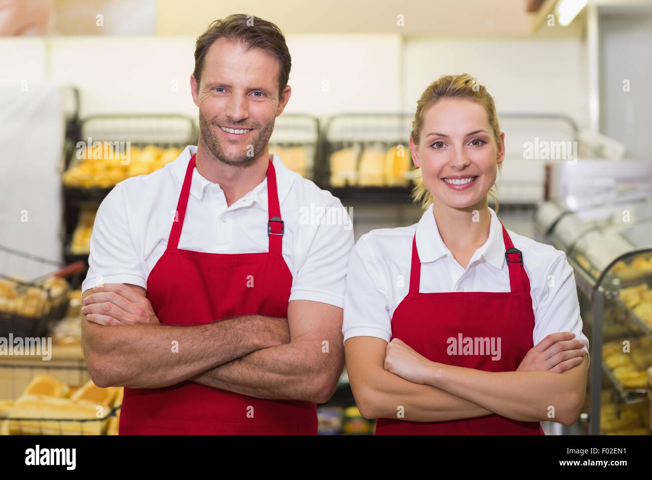 Portrait of smiling bakers with arms crossed Stock Photo - Alamy