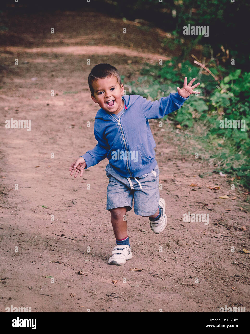 Boy running hi-res stock photography and images - Alamy