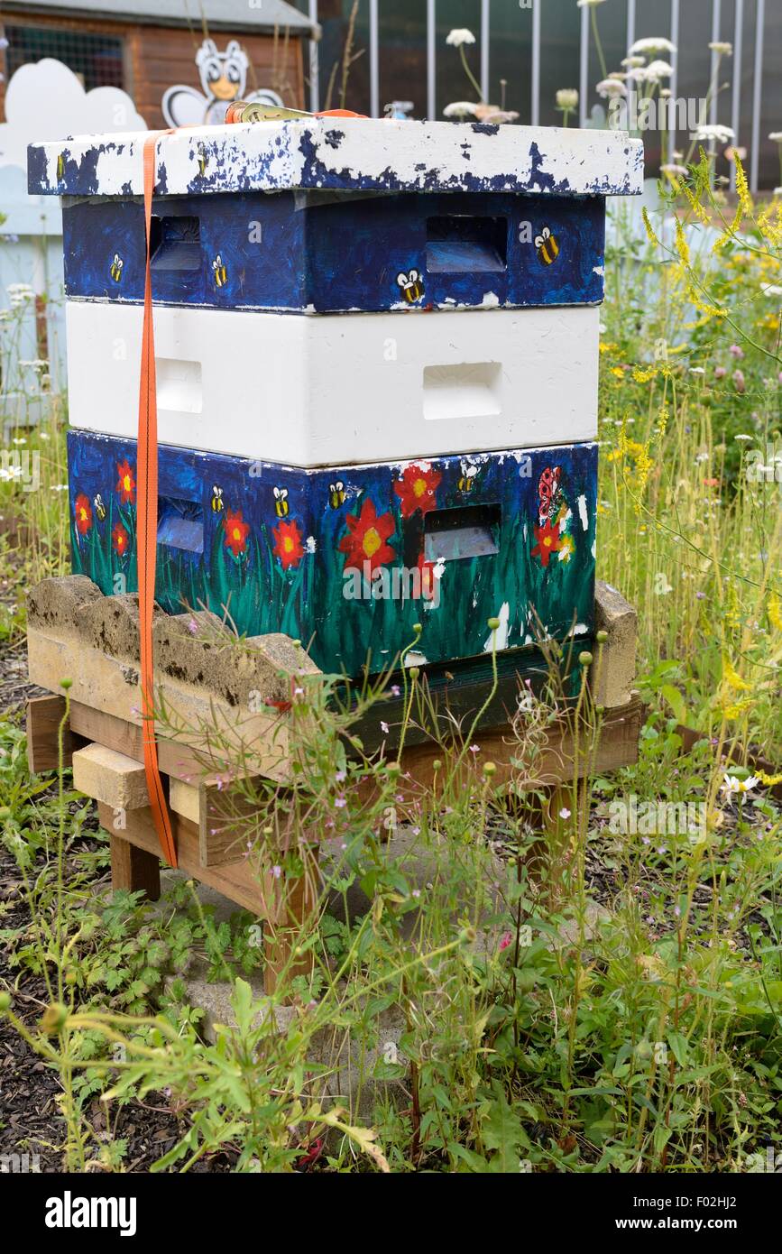 A beehive surrounded by wild flowers at the Amazonia attraction in ...