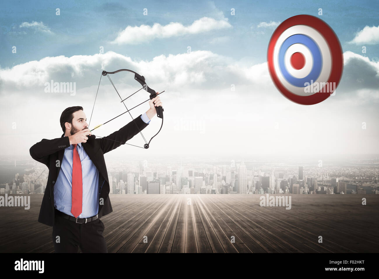 Composite image of focused businessman shooting a bow and arrow Stock ...
