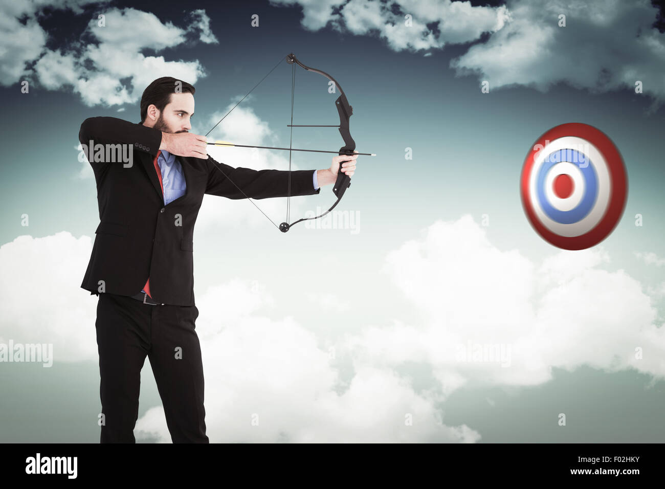 Composite image of focused businessman shooting a bow and arrow Stock ...