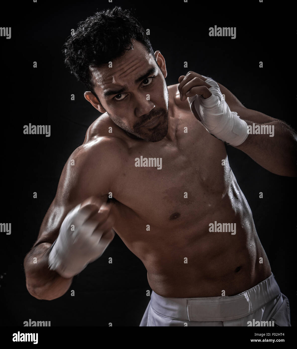 Male boxer punching Stock Photo - Alamy