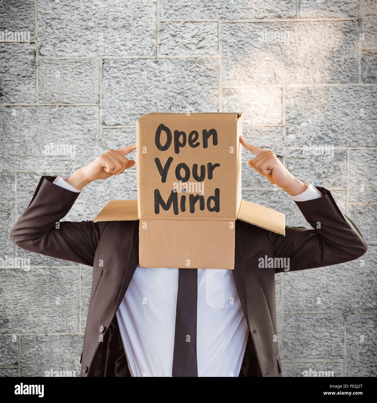 Composite image of anonymous businessman pointing to box Stock Photo ...