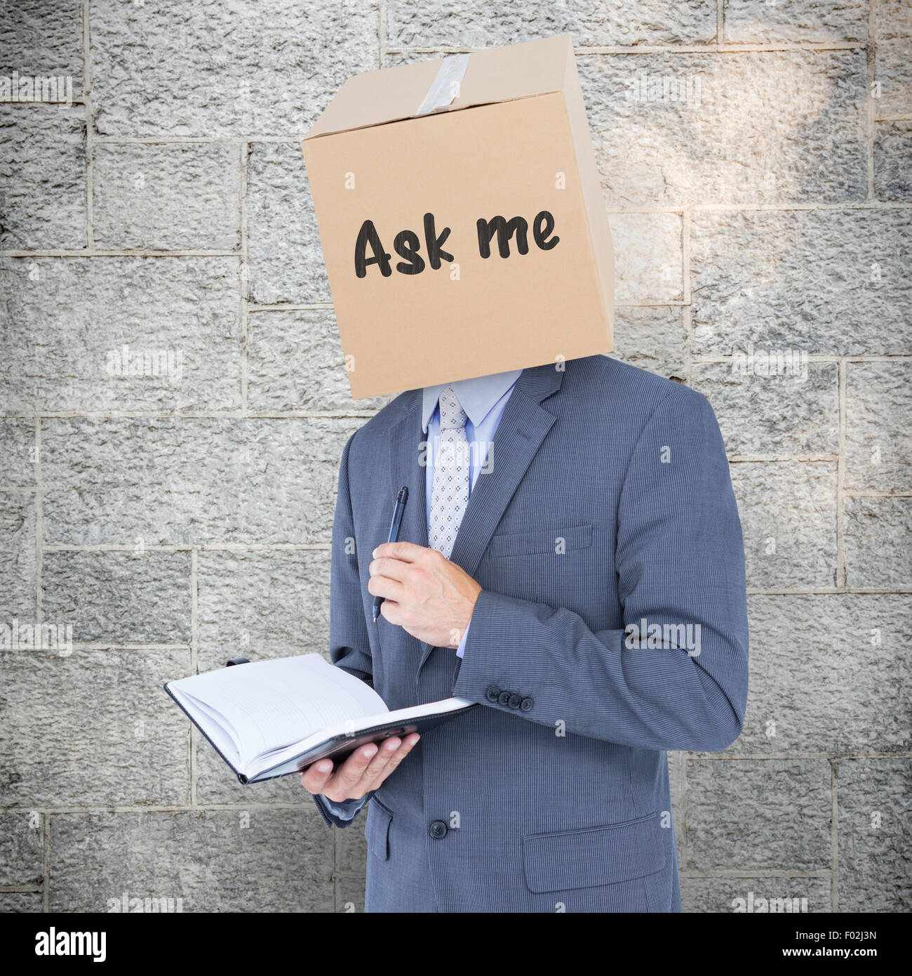 Composite image of anonymous businessman with diary Stock Photo - Alamy