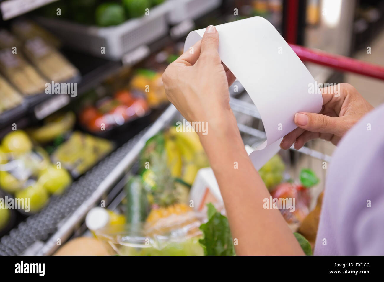 Woman reading her shopping list Stock Photo - Alamy