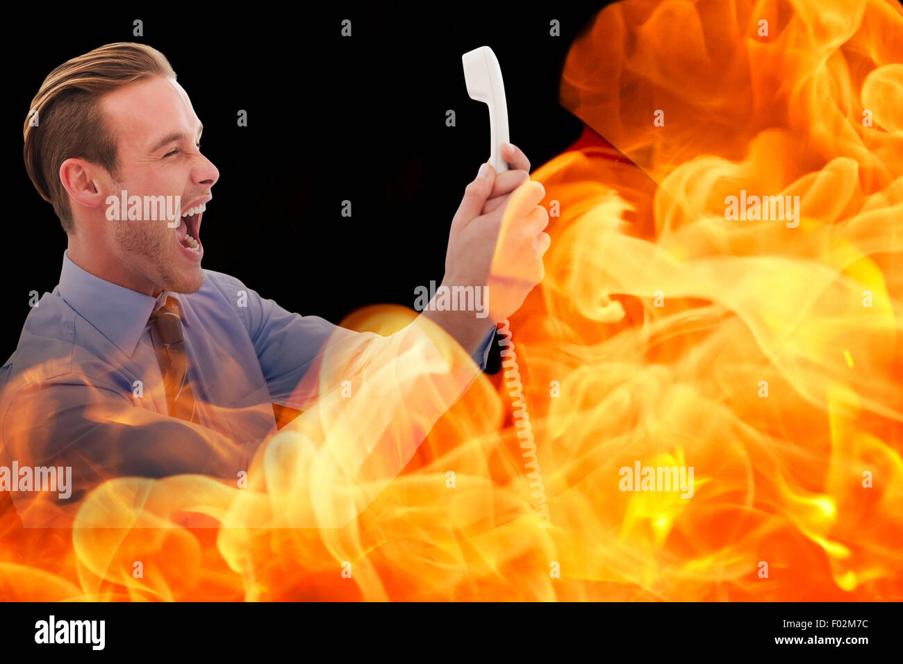 Composite image of businessman shouting at phone Stock Photo - Alamy