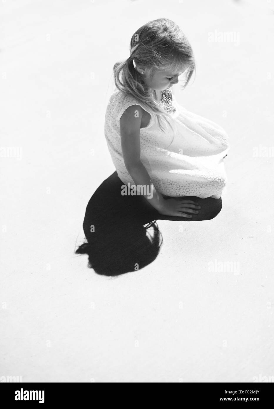 Beautiful girl sitting down Black and White Stock Photos & Images - Alamy