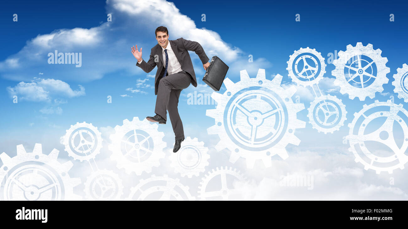 Composite image of happy businessman in a hurry Stock Photo - Alamy