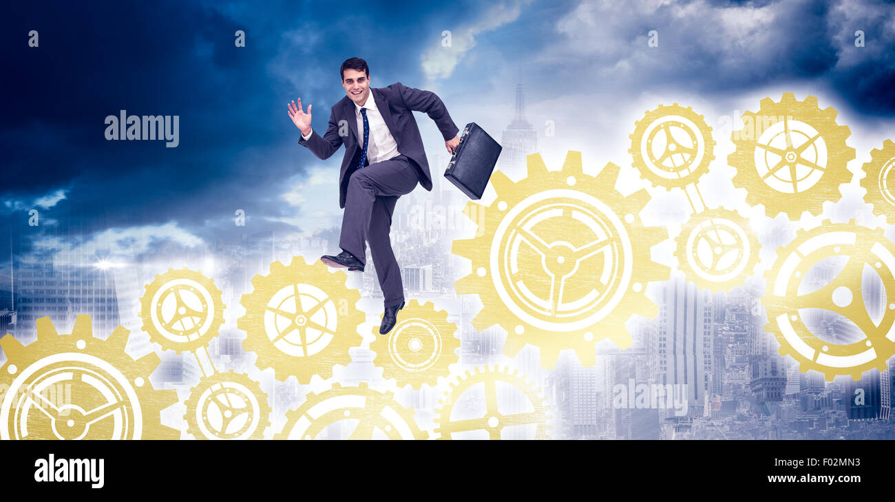 Composite image of happy businessman in a hurry Stock Photo - Alamy