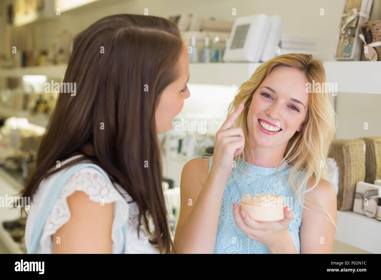 Woman applying beauty products shop hi-res stock photography and images ...