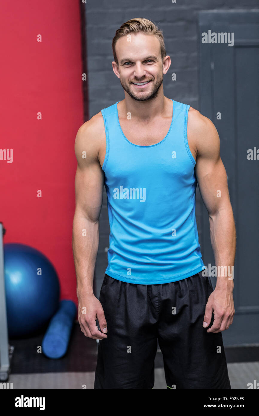 Muscular man smiling at camera Stock Photo - Alamy