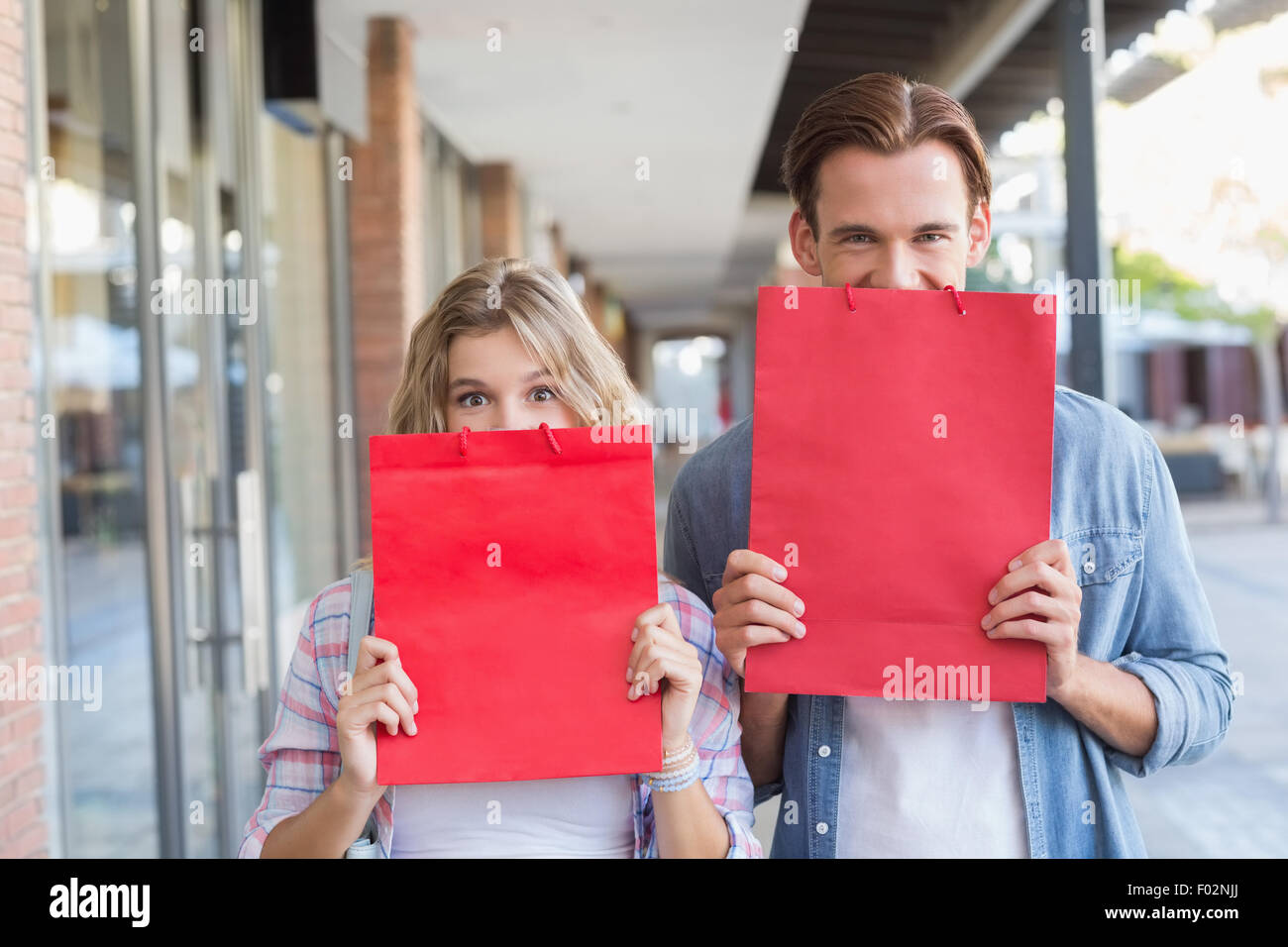 Hiding behind bag hi-res stock photography and images - Alamy