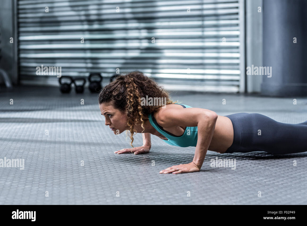 Crossfit female athlete doing pushups hi-res stock photography and ...