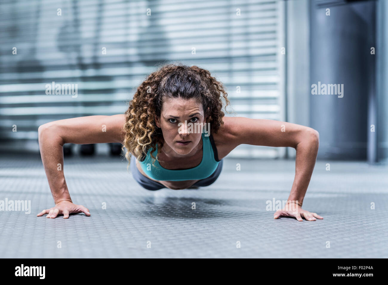 Crossfit female athlete doing pushups hi-res stock photography and ...