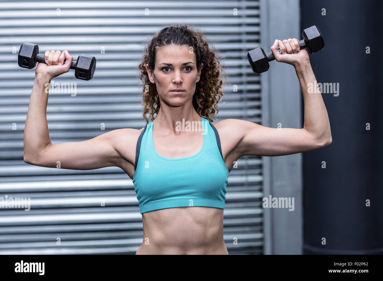 Woman lifting weights hi-res stock photography and images - Alamy