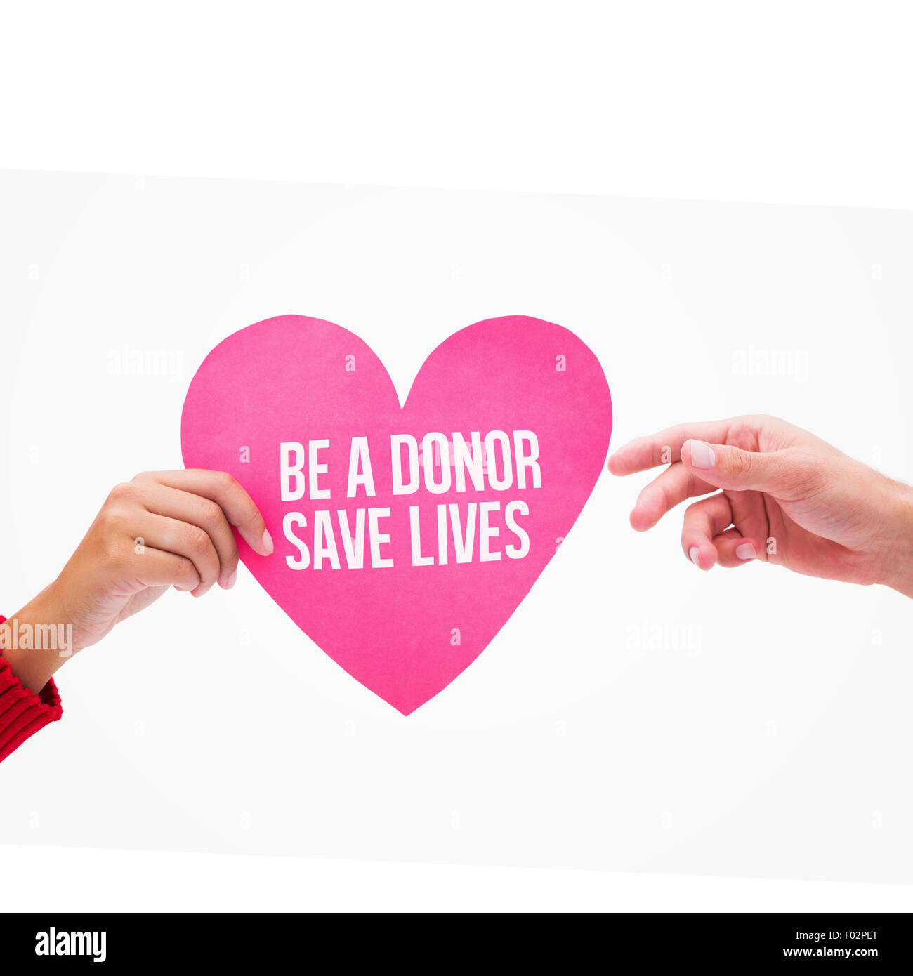 Composite image of woman passing man pink heart Stock Photo - Alamy