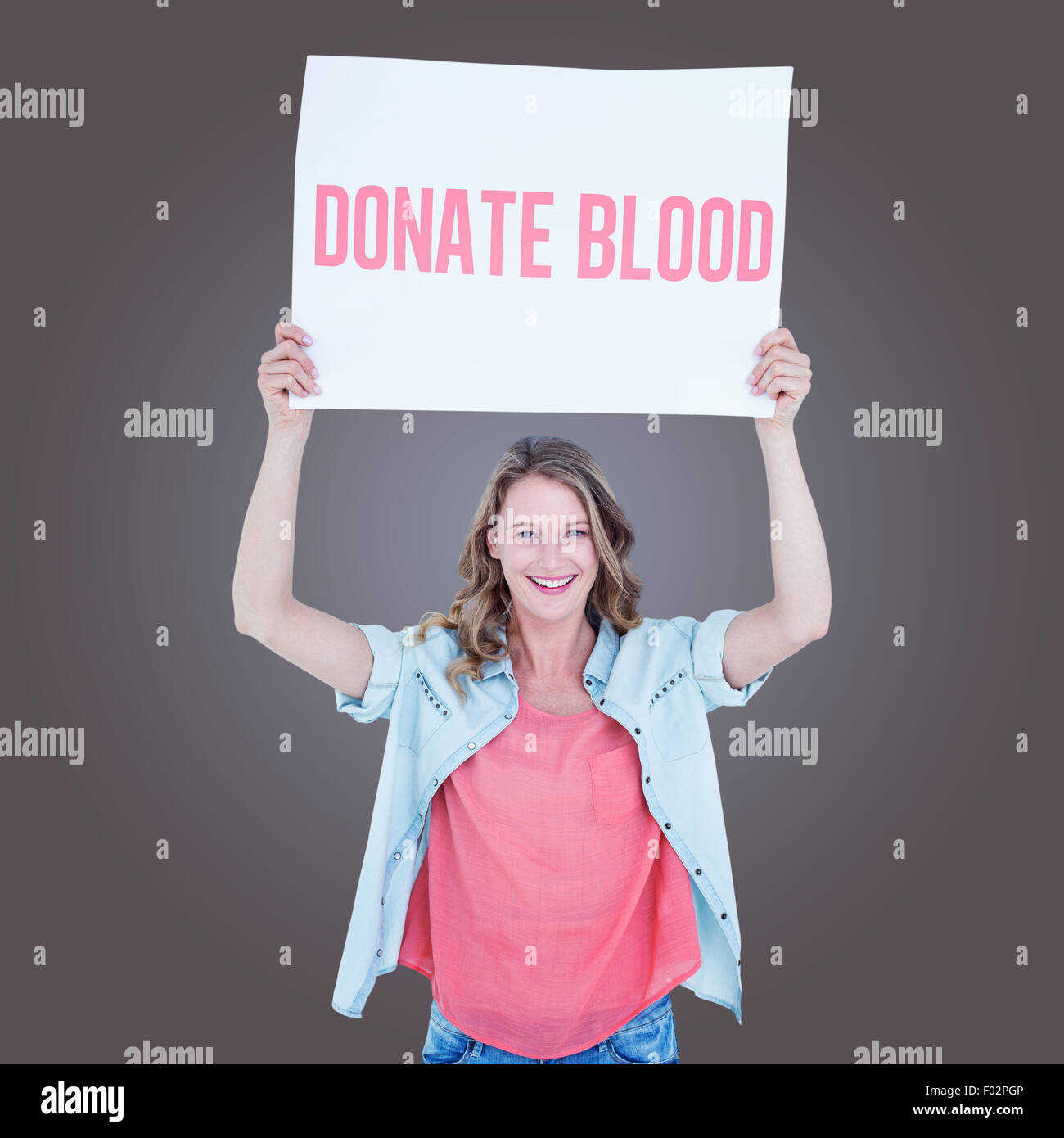 Woman holding poster hi-res stock photography and images - Alamy