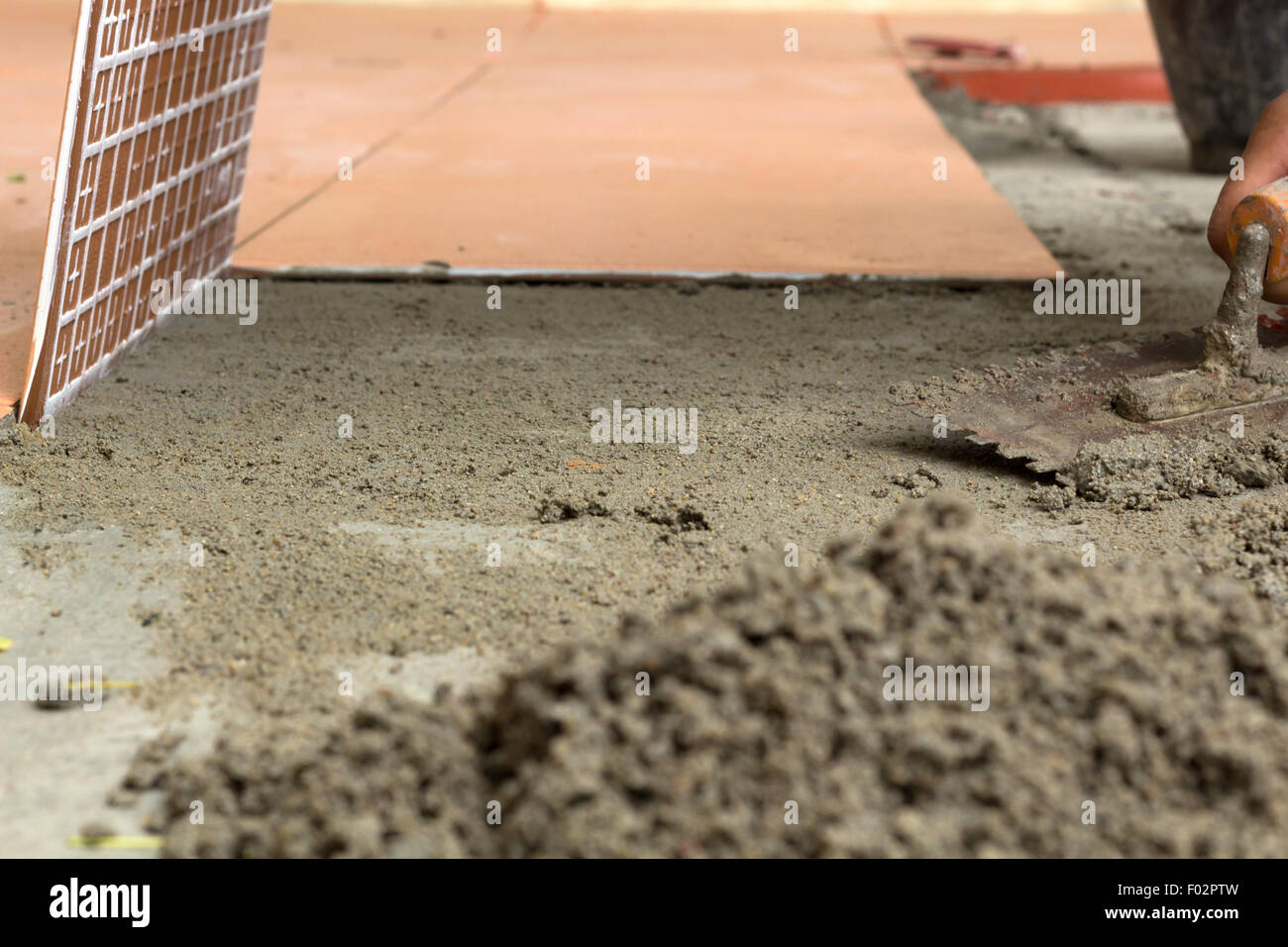 Tiler work bonding floor tile hi-res stock photography and images - Alamy