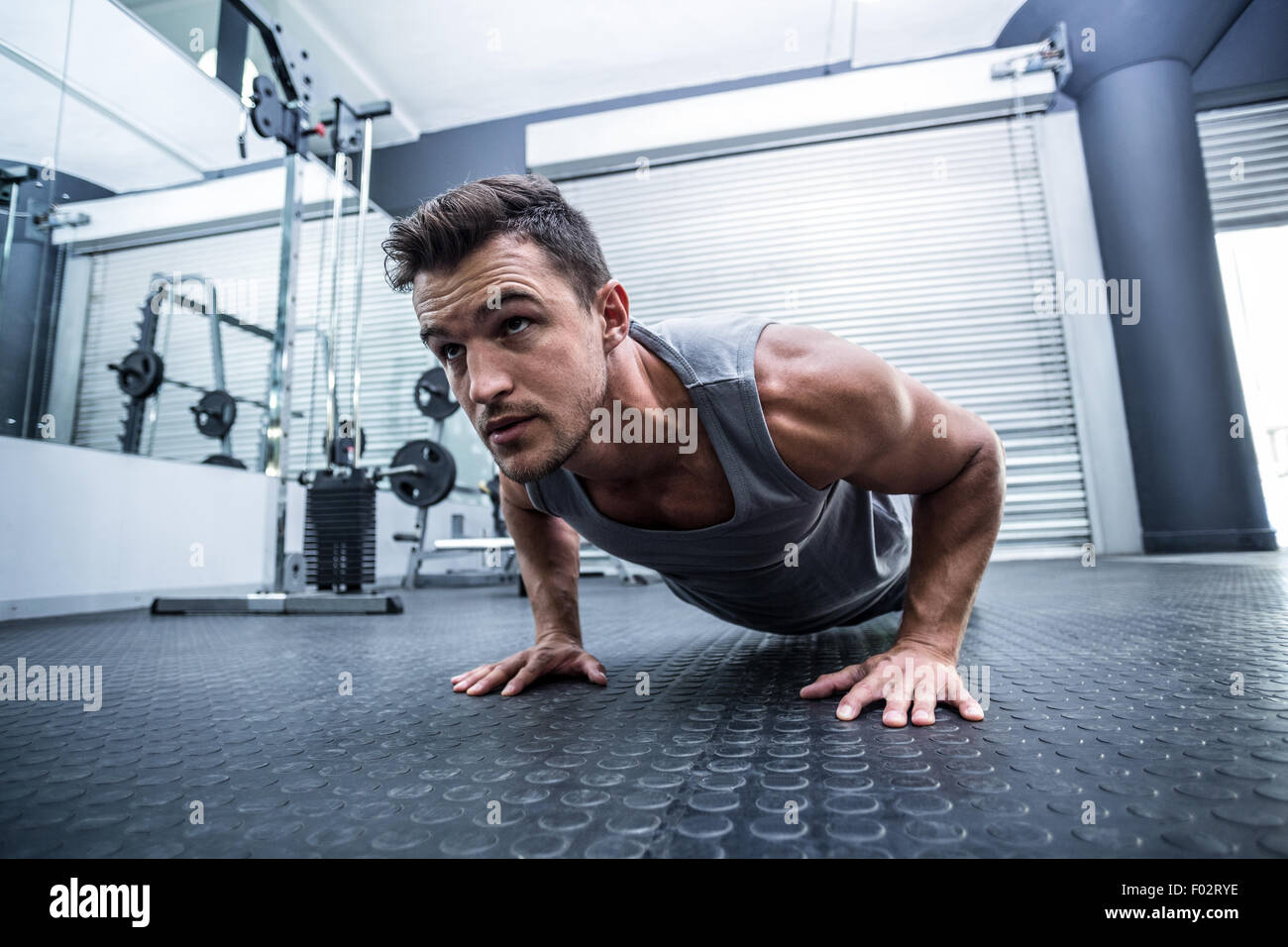A muscular man doing a pushups Stock Photo - Alamy