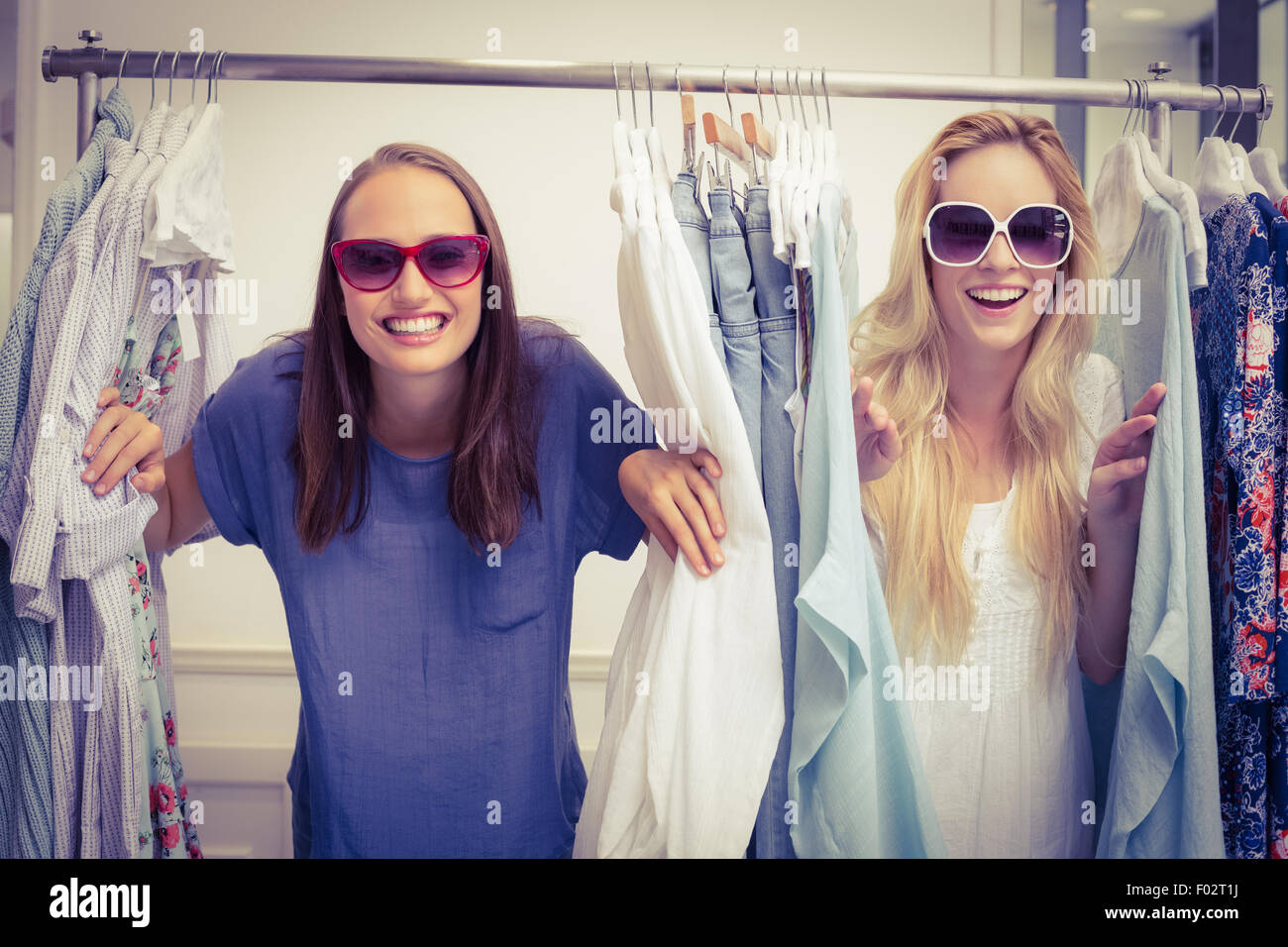 Woman browsing through clothes hi-res stock photography and images - Alamy